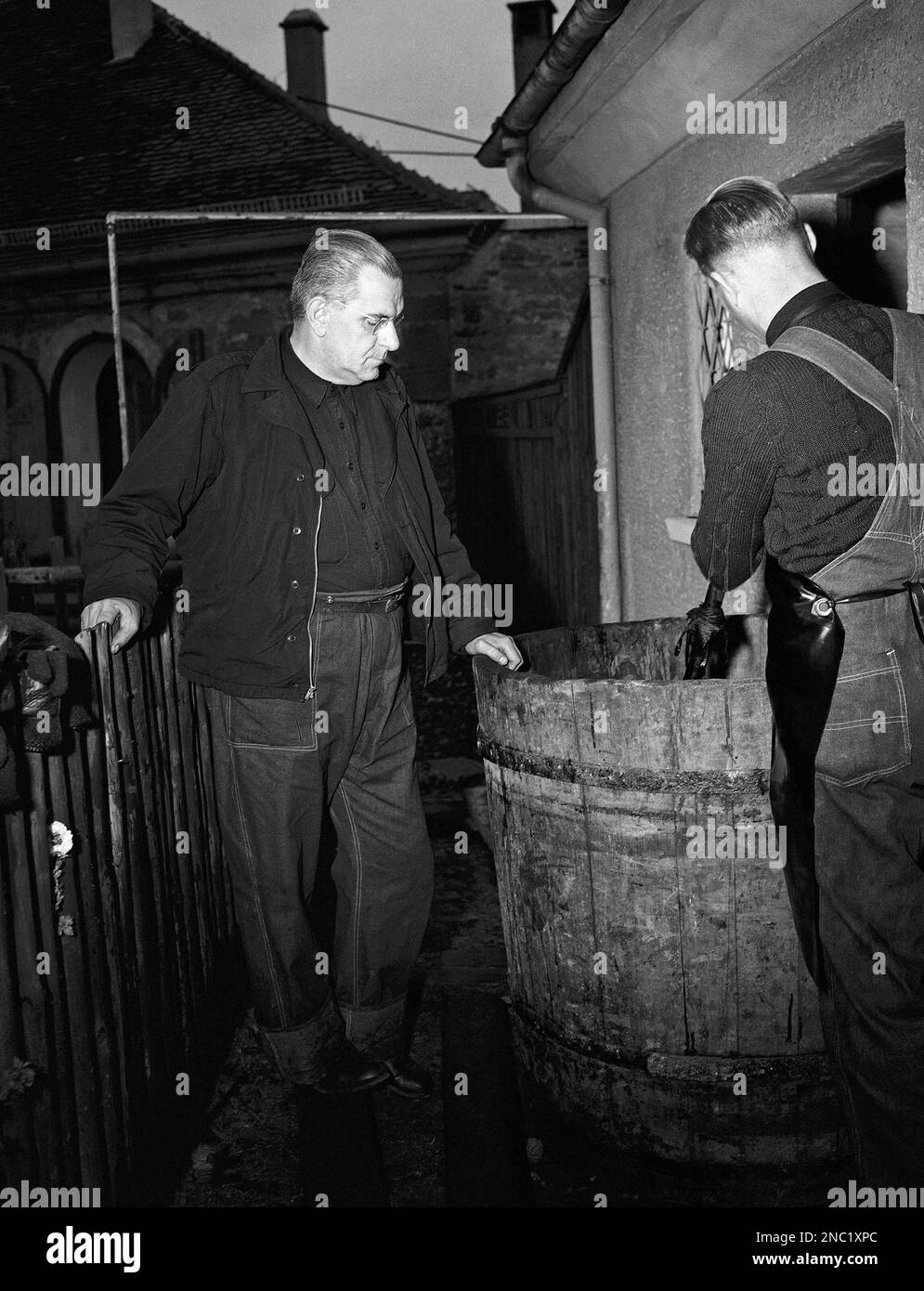 Fritz Julius Kuhn, a chemist by profession, supervises the mixing of ...