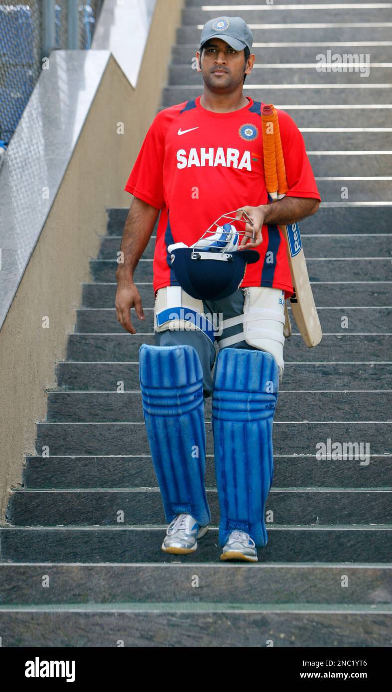 India's captain Mahendra Singh Dhoni steps down from the pavilion as he ...