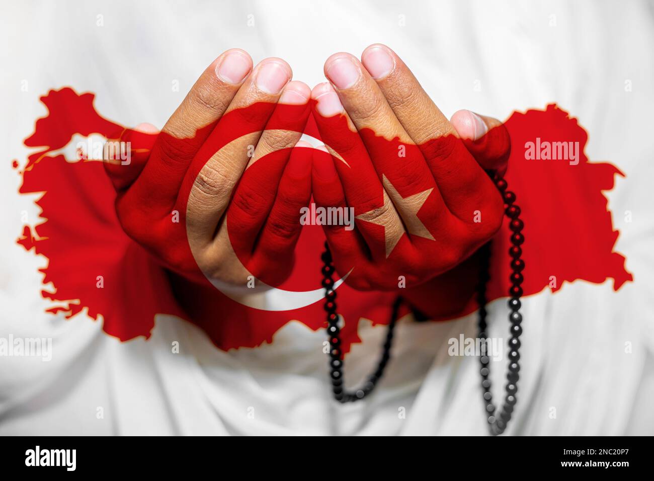 A Muslim woman raises her hands to pray. Support and prayers for ...