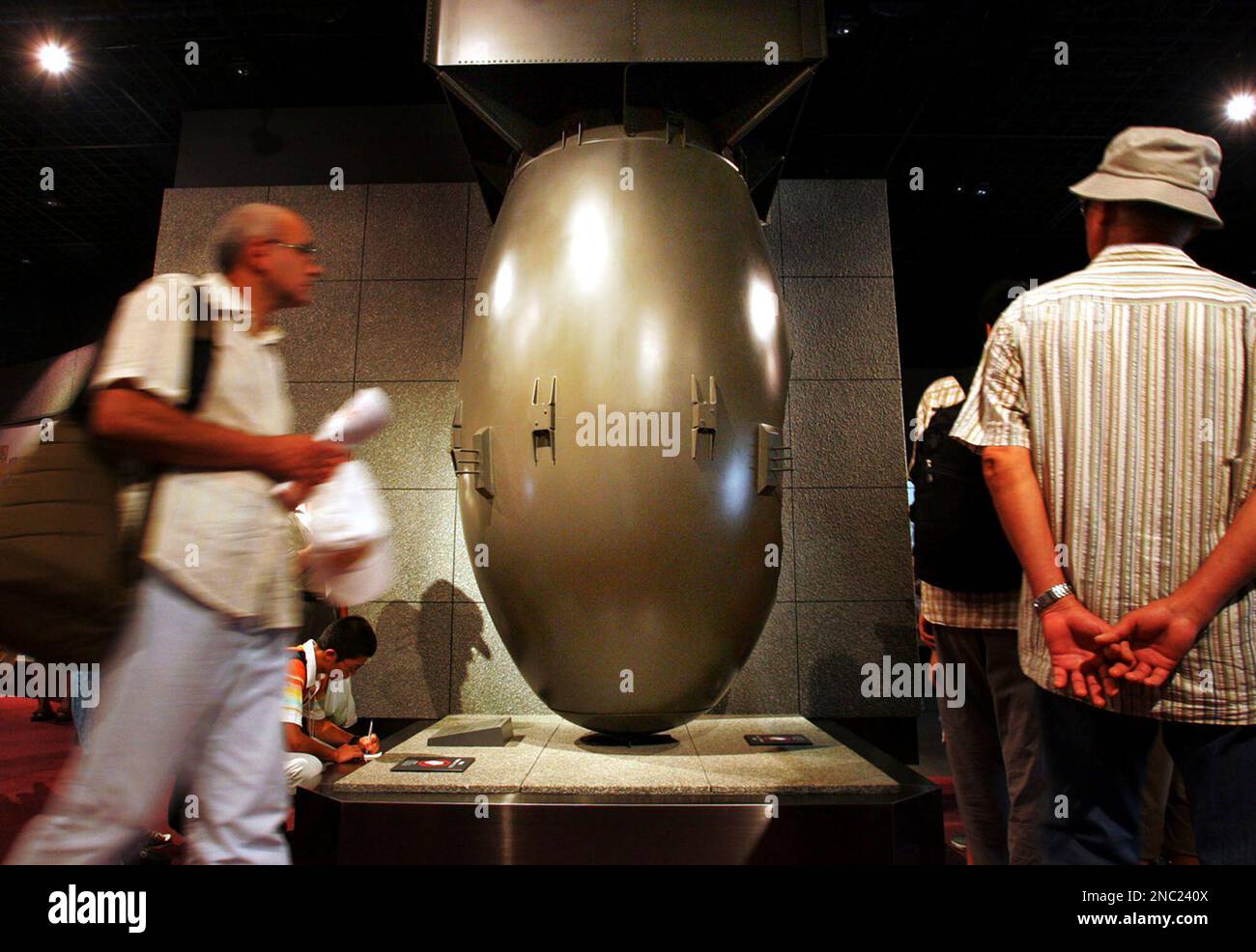 FILE- This Monday, Aug. 8, 2005 file photo shows visitors as they look ...