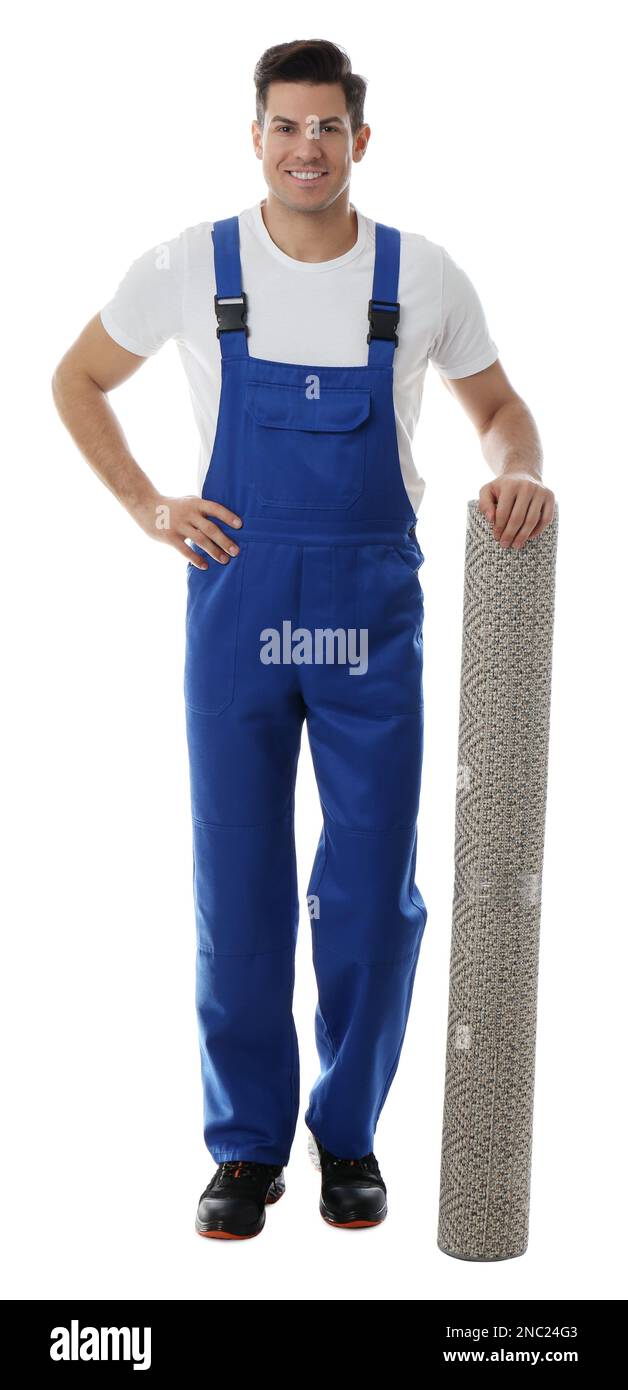Male worker with rolled carpet on white background Stock Photo - Alamy
