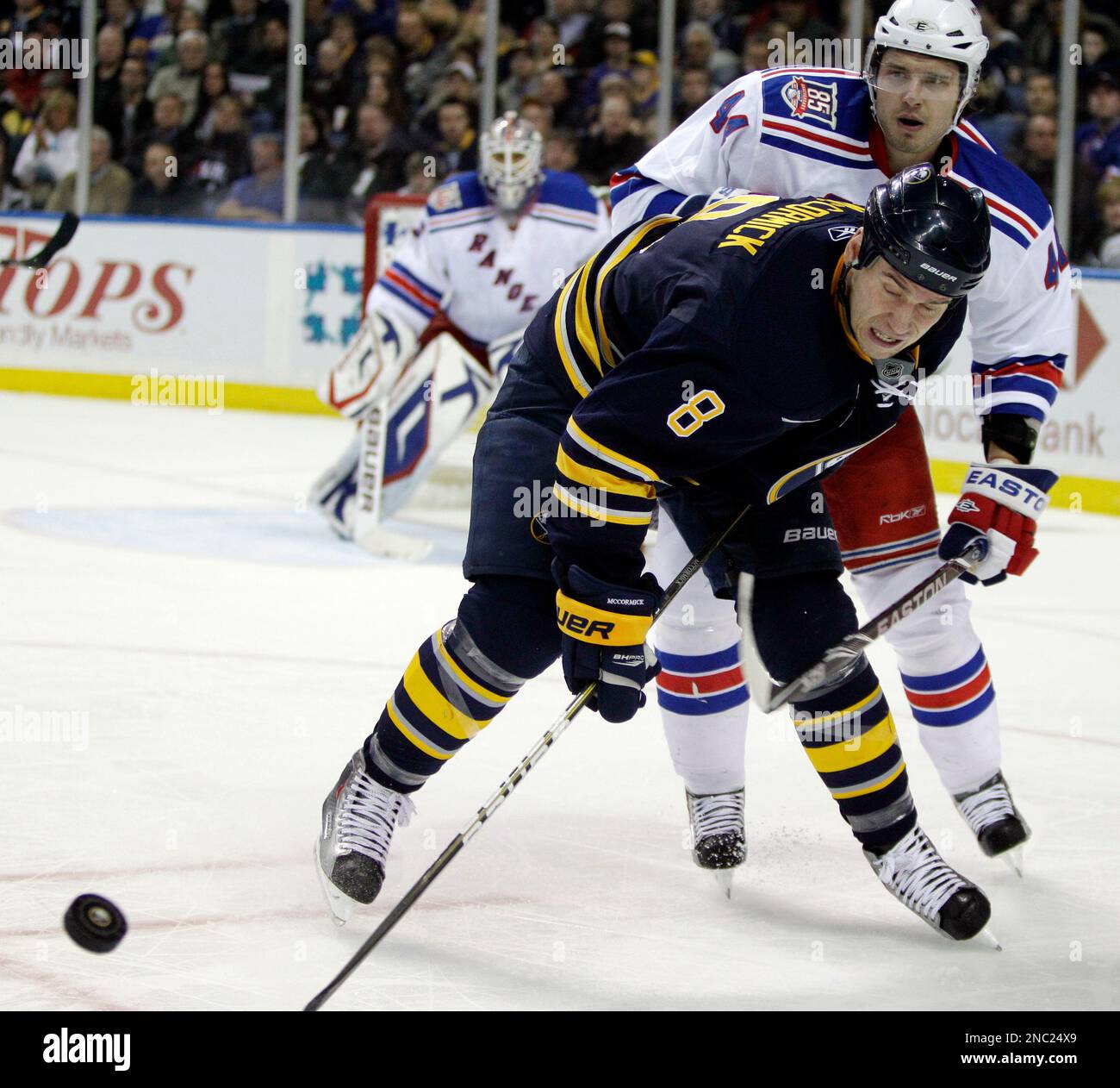 Buffalo Sabres' Cody McCormick (8) battles for the puck with New York ...