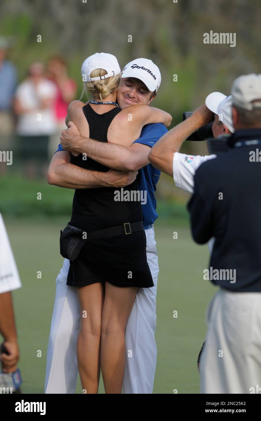 Martin Laird, of Scotland, center, is congratulated by his fiancee ...