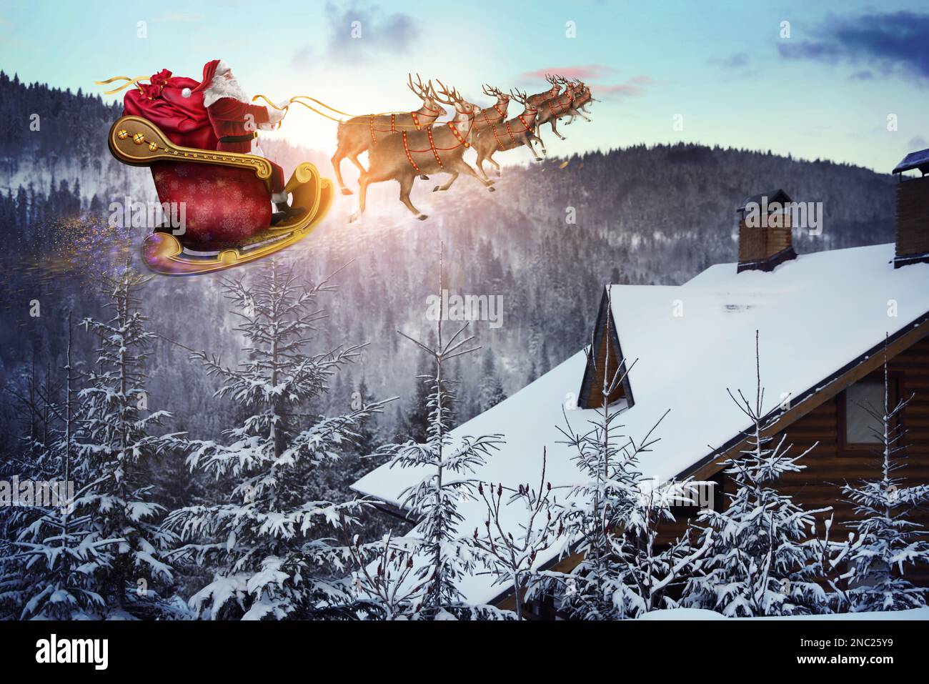 Magic Christmas eve. Santa with reindeers flying in sky Stock Photo - Alamy