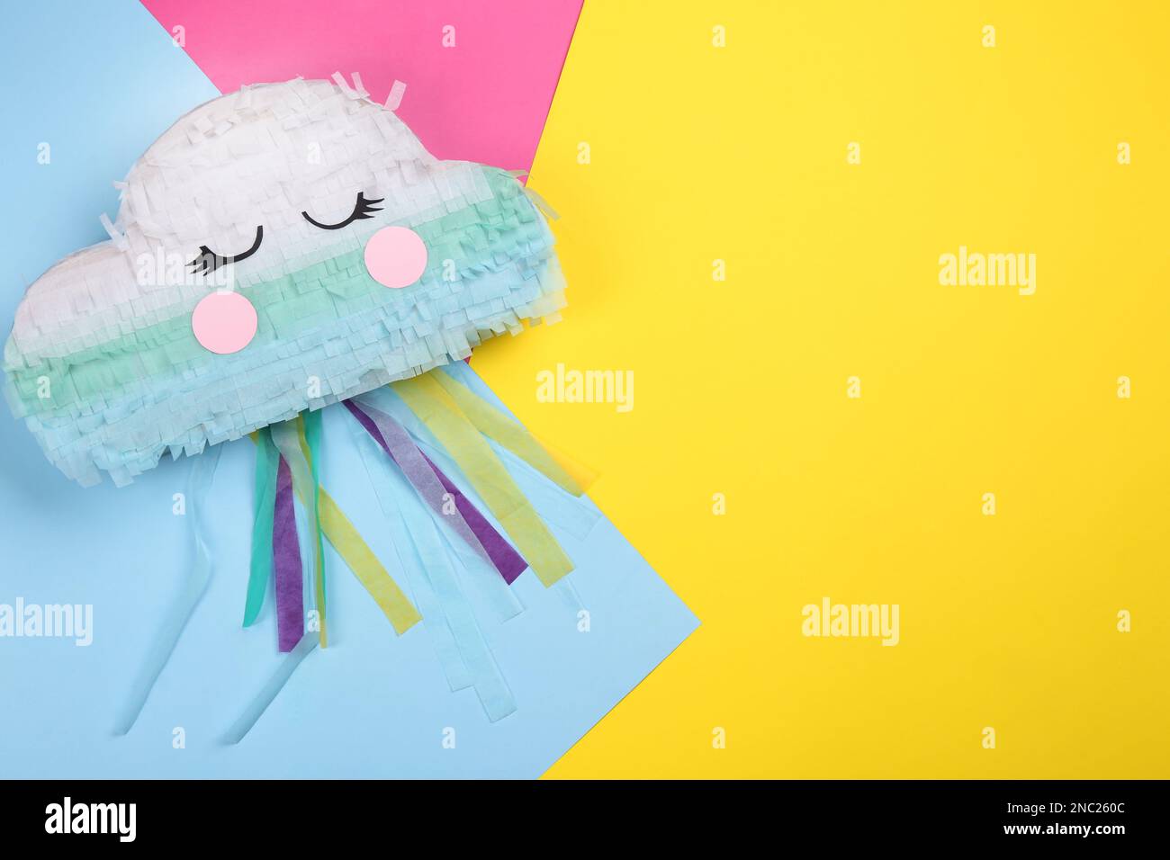 Cloud shaped pinata on color background, top view. Space for text Stock ...