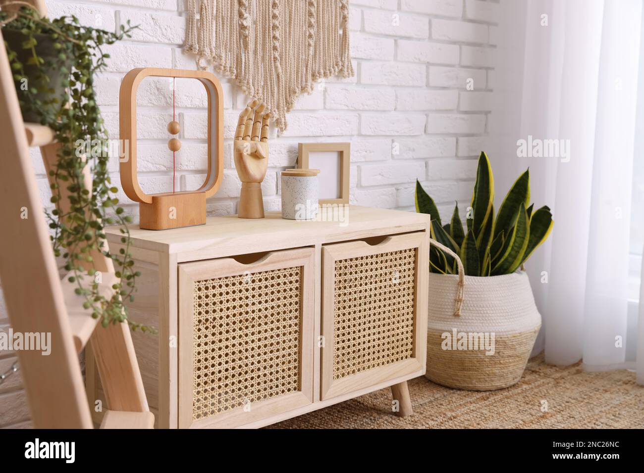 Modern room with wooden commode. Interior design Stock Photo - Alamy