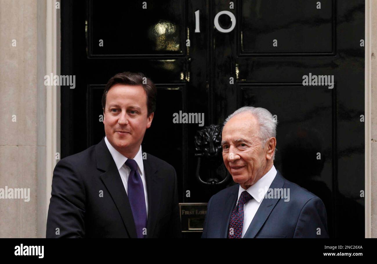 Britain's Prime Minister David Cameron, left, greets Israel's President ...