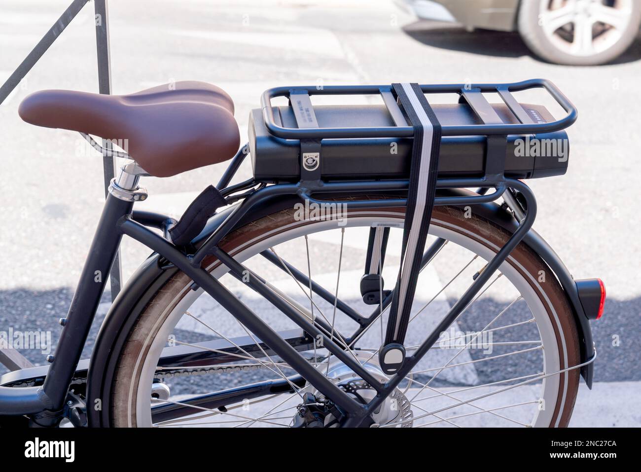 Modern electric bike battery on a cycle in the street Stock Photo - Alamy