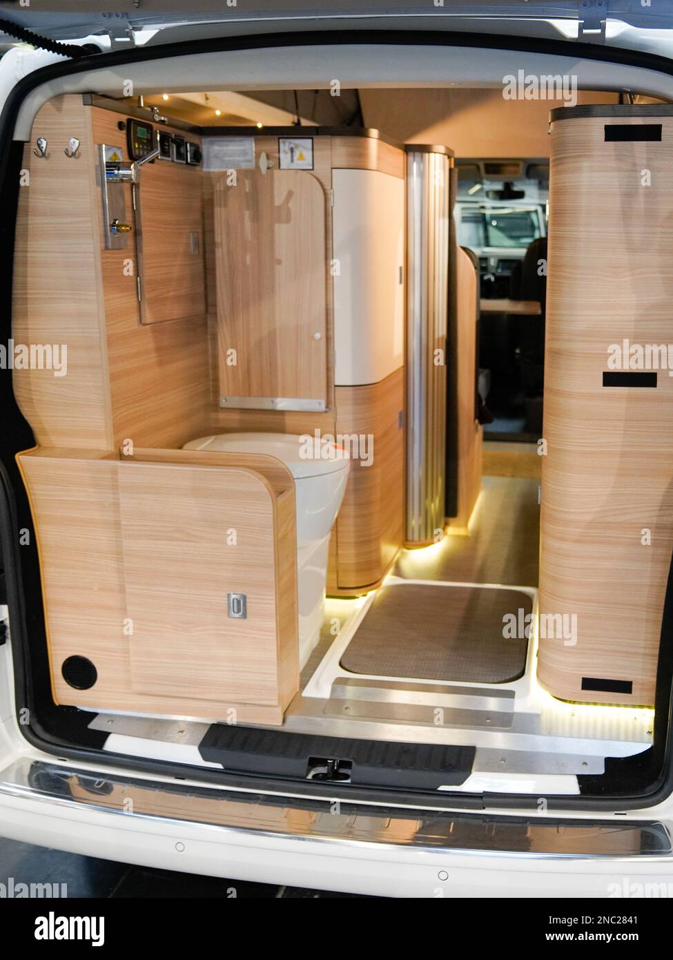 Modern camper inside van back interior bed Stock Photo - Alamy