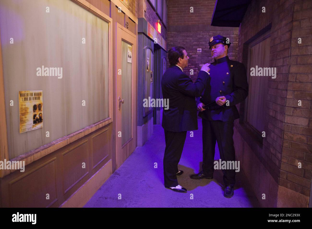 Actors playing a beat cop and a mobster act out a scene at the Mob ...