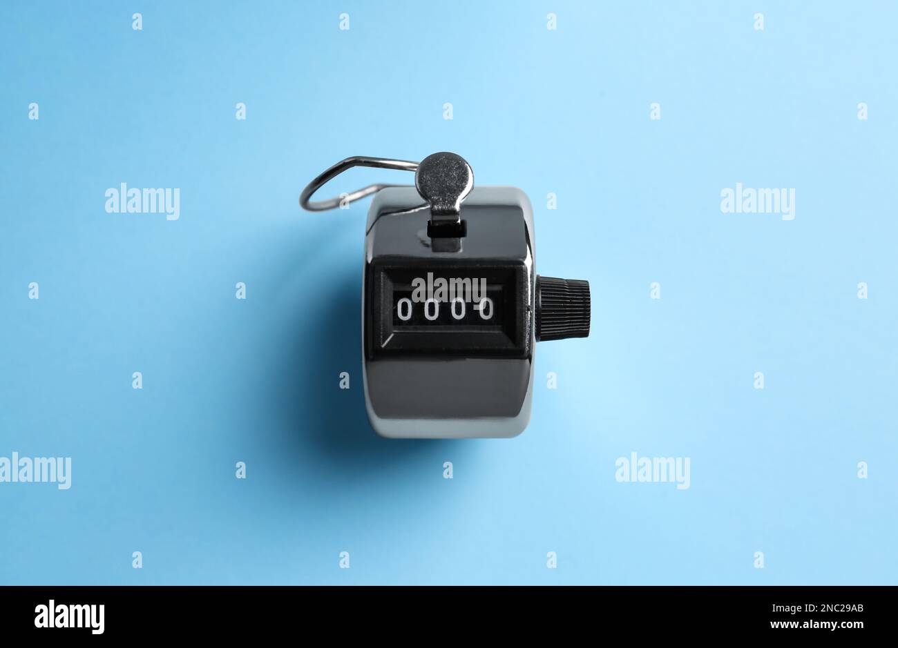 Modern timer on light blue background, top view Stock Photo - Alamy