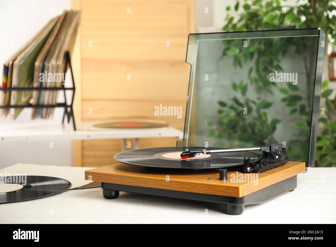 Stylish turntable and vintage vinyl records indoors Stock Photo - Alamy