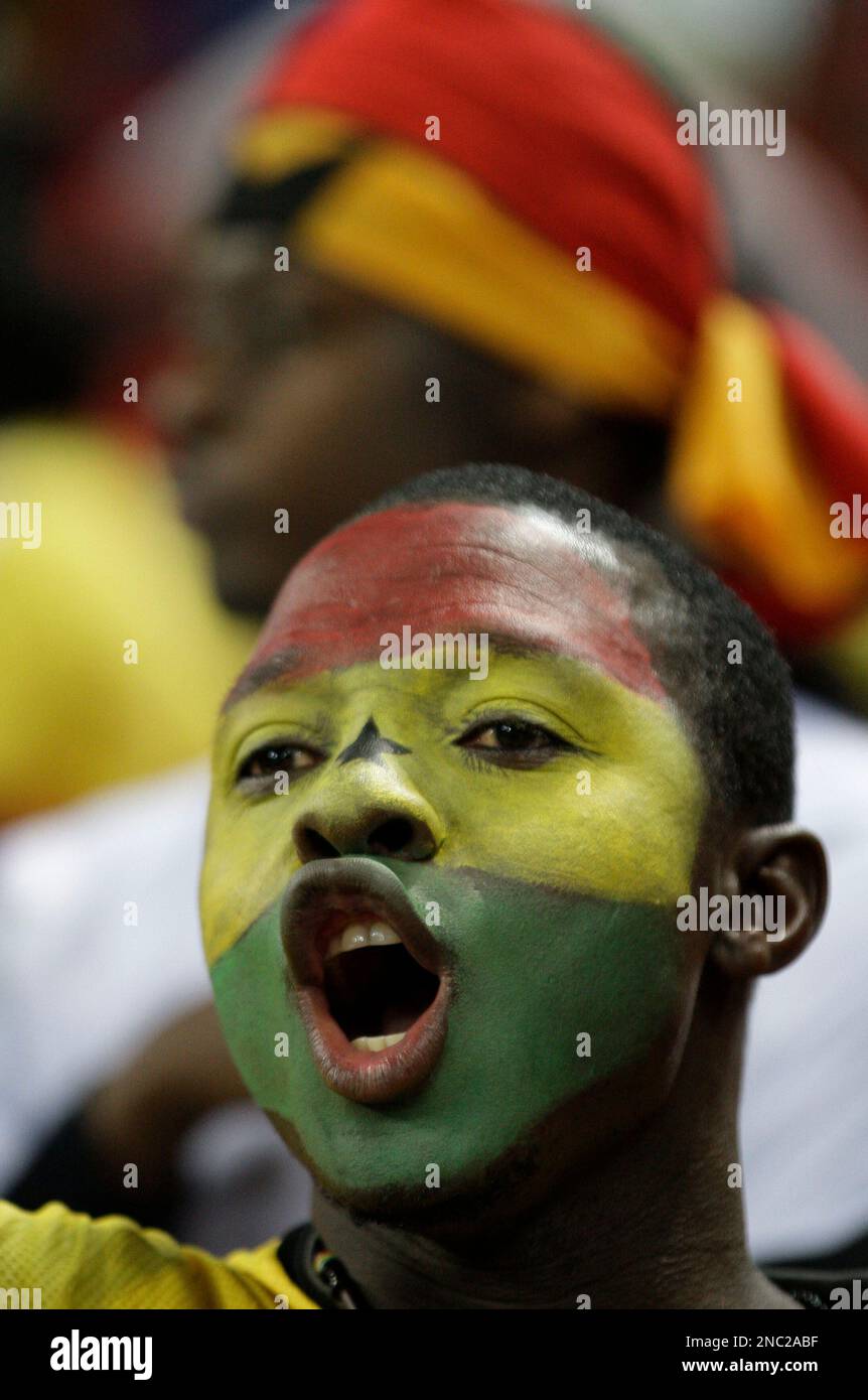 A Ghana supporter cheers on his team before the start of their ...