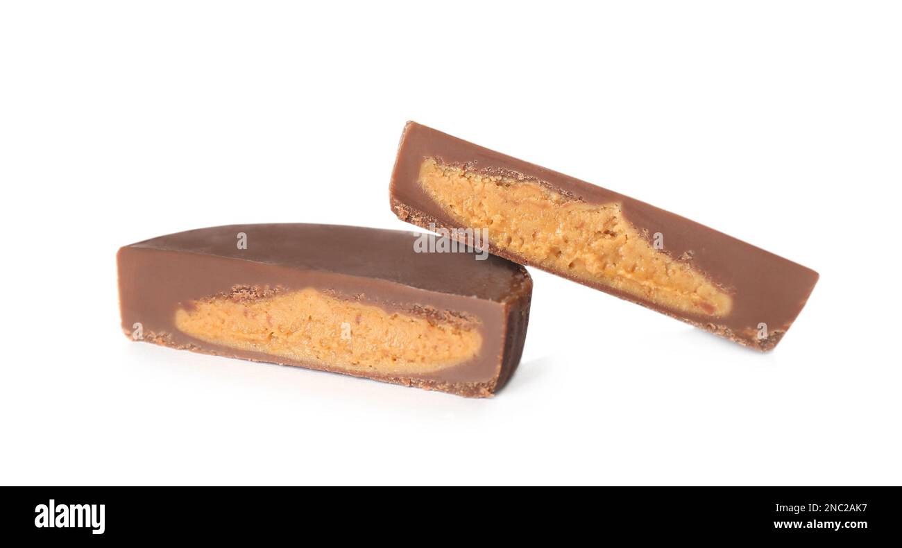 Cut peanut butter cup isolated on white Stock Photo - Alamy