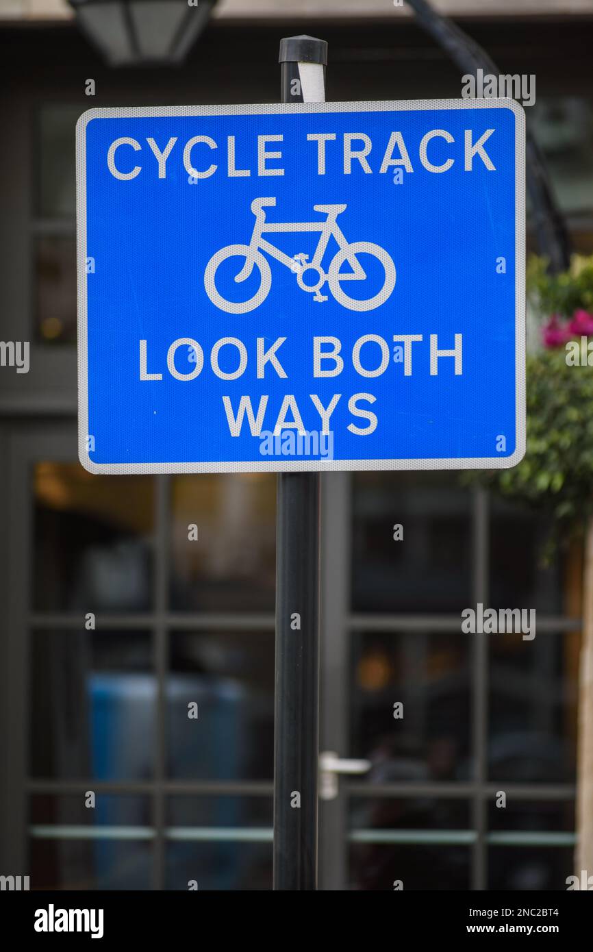 A blue street sign in London, UK advises traffic and pedestrians there ...