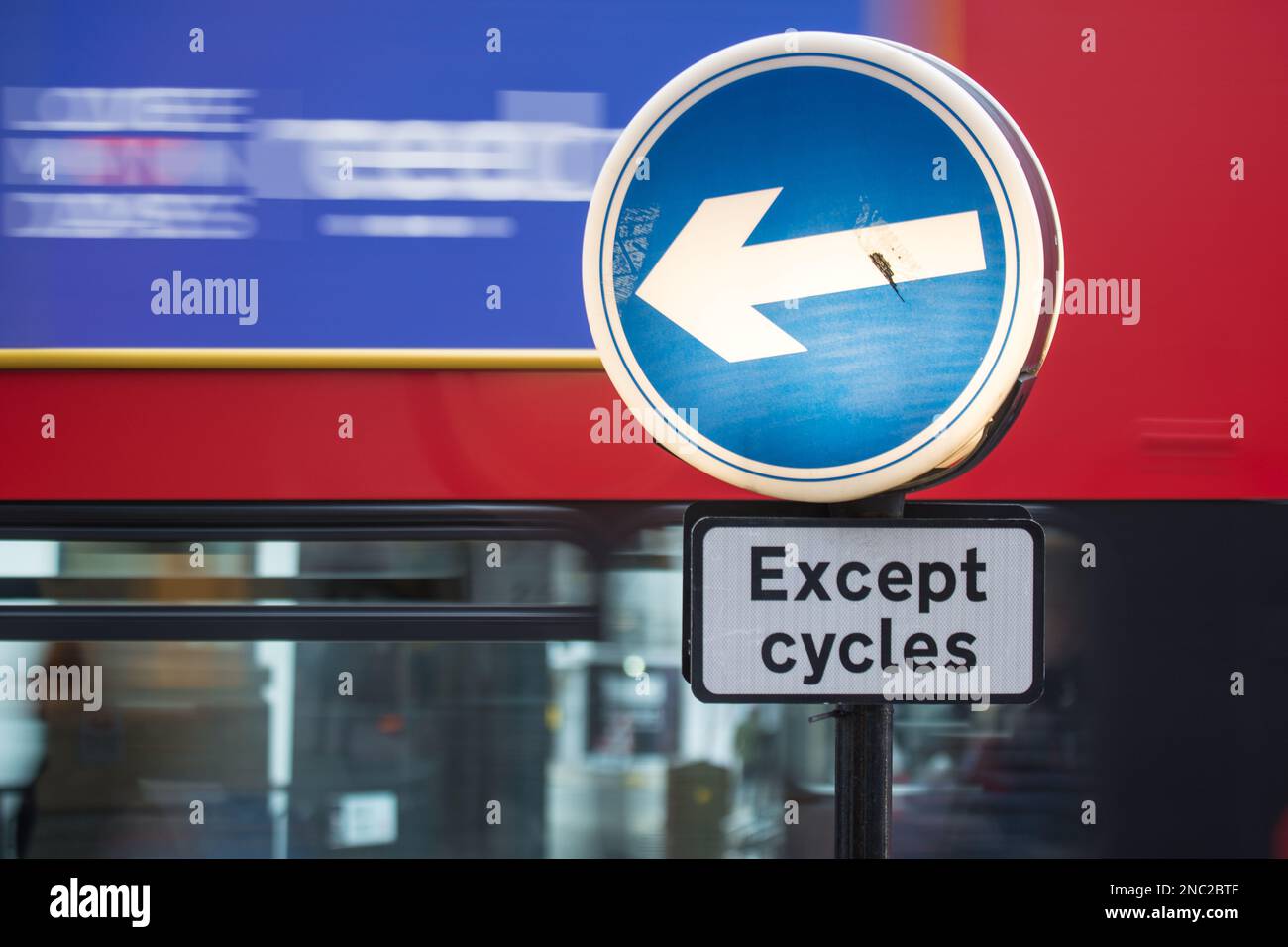 A one way road sign in London indicates traffic can only pass in one ...