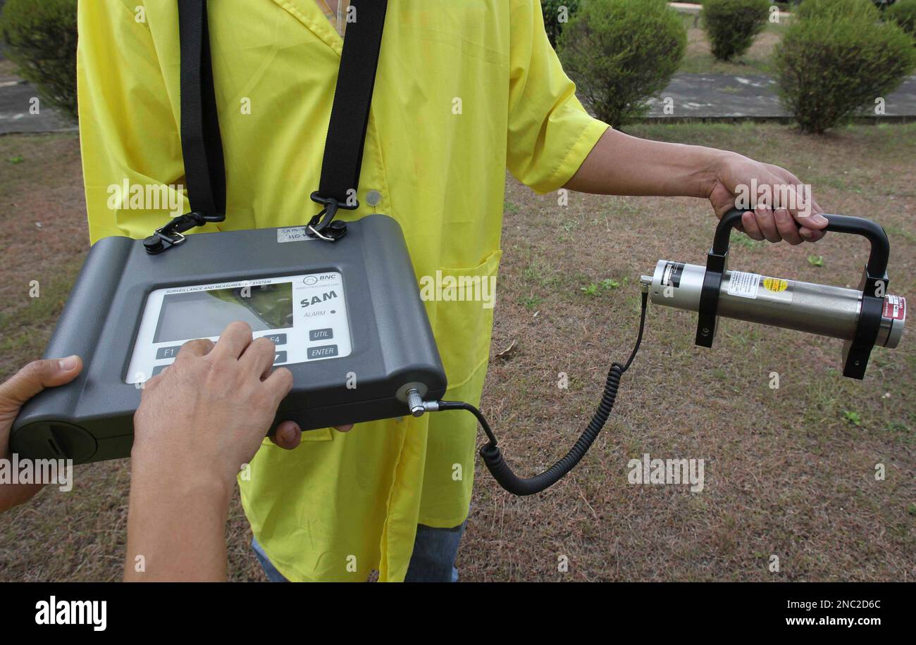 Filipino scientists at the Philippine Nuclear Research Institute ...