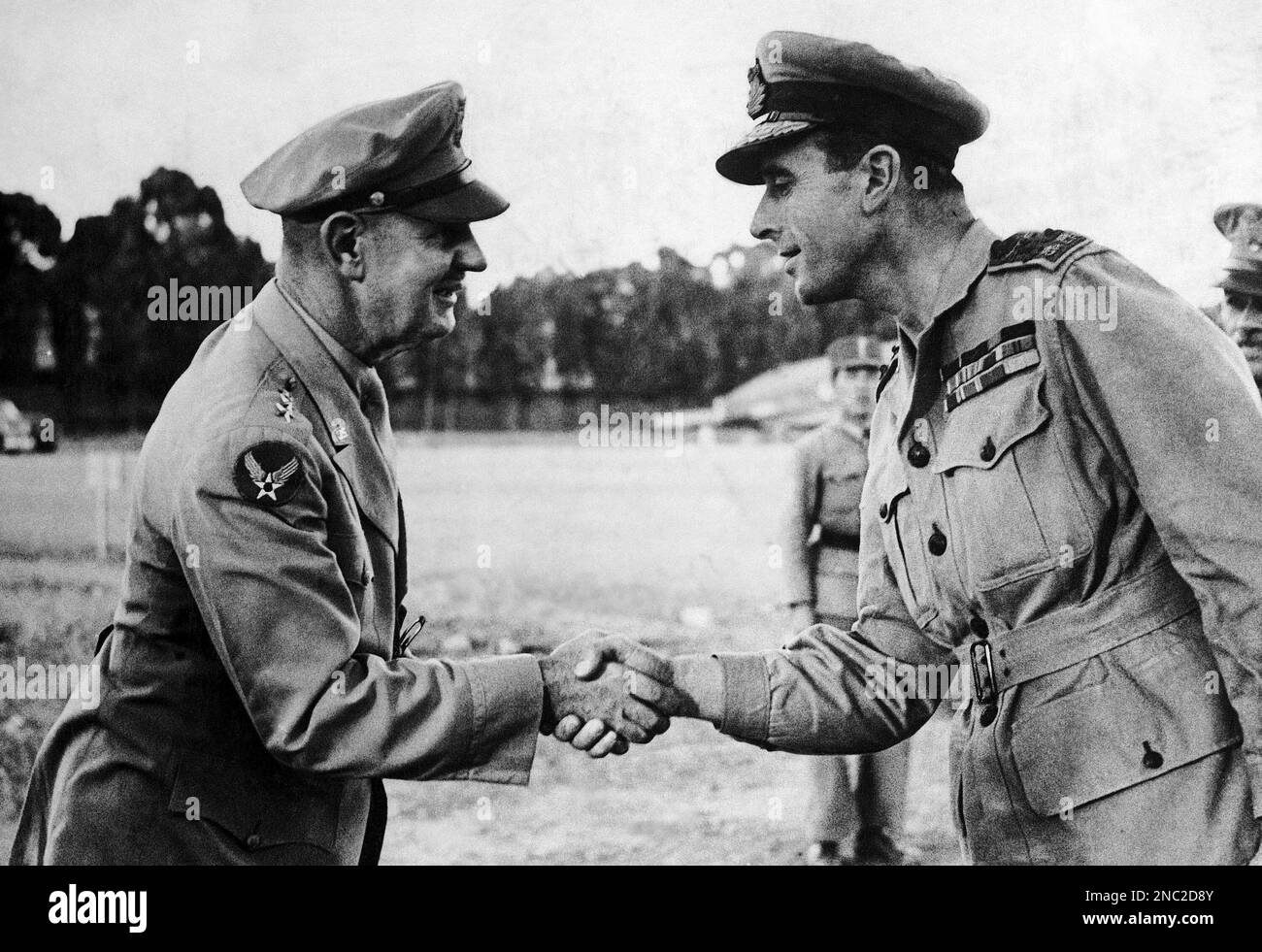 Admiral Lord Louis Mountbatten, Supreme Commander South East Asia, shaking hands with General ...