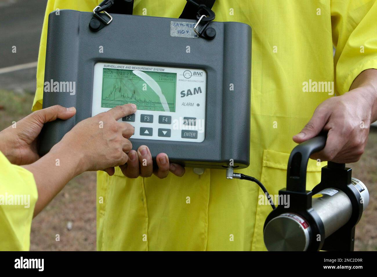 Filipino scientists at the Philippine Nuclear Research Institute ...
