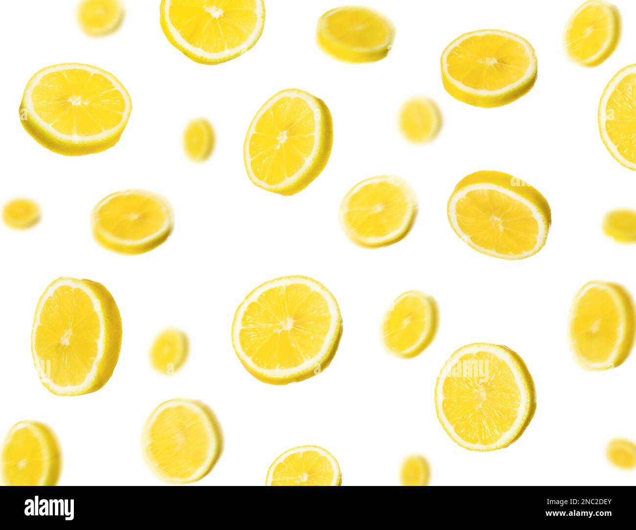 Fresh ripe lemons falling on white background Stock Photo - Alamy