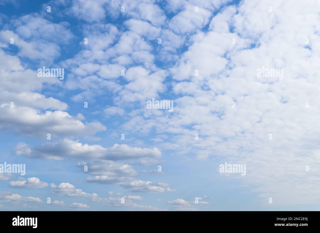 Beautiful fluffy white clouds in blue sky Stock Photo - Alamy