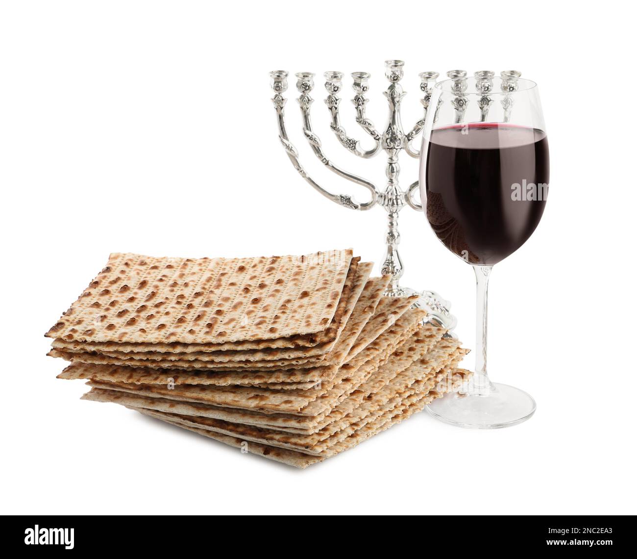 Traditional matzos, red wine and menorah on white background Stock ...