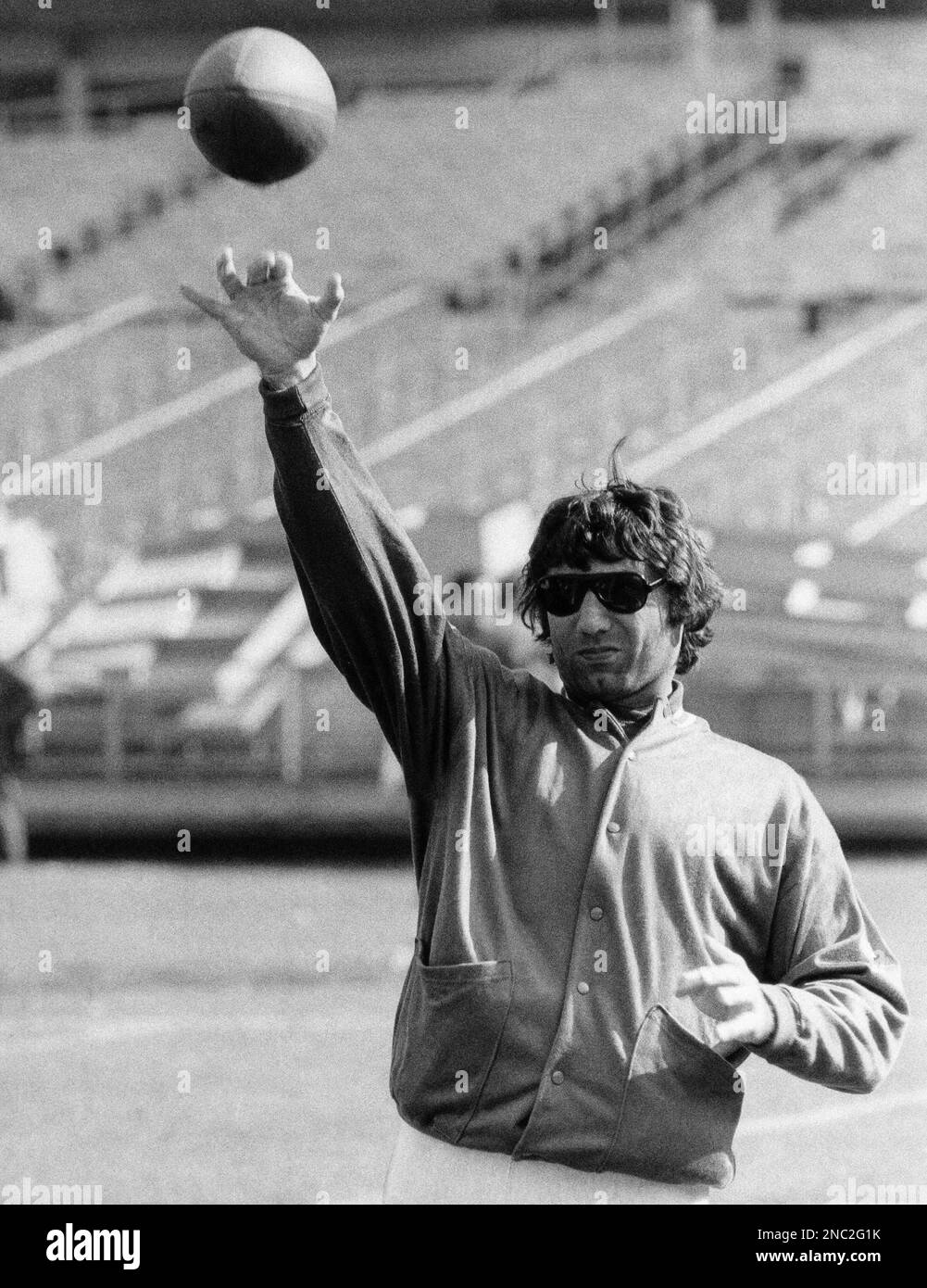 Professional sportsperson standing hand raised sunglasses sport hi-res ...