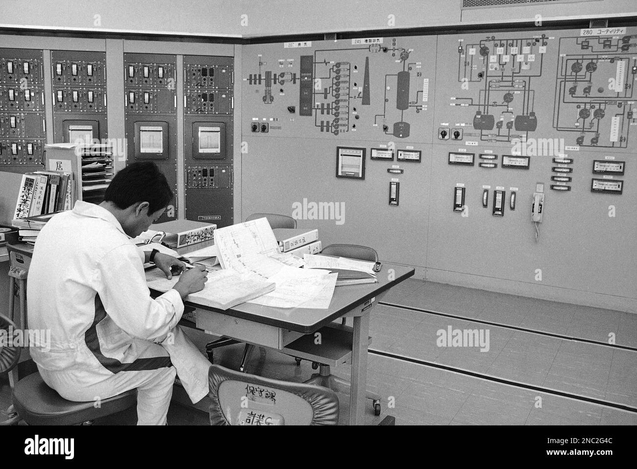 Japanese engineers work at control room of main plant of the Tokai ...