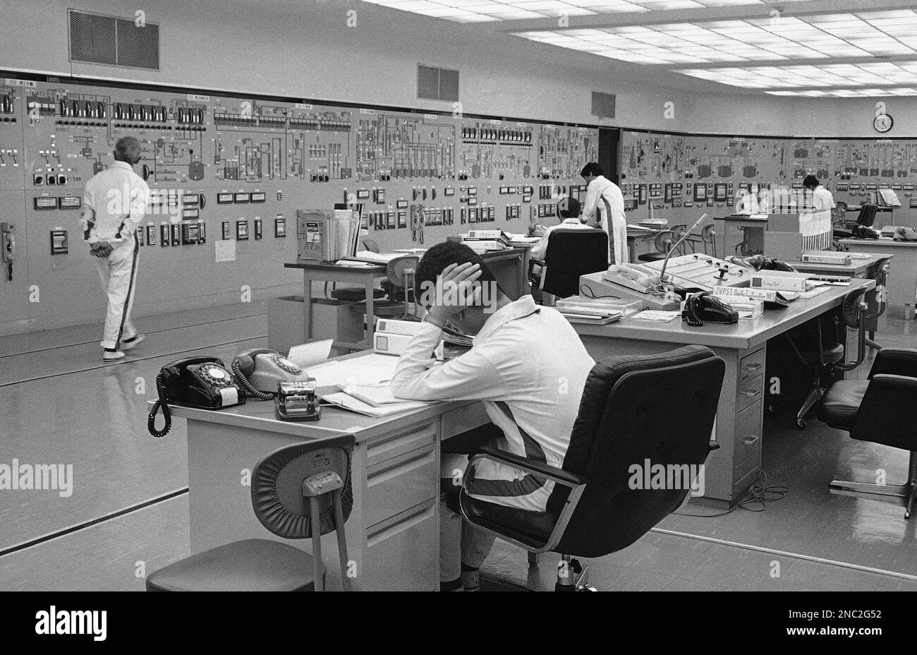 Japanese engineers work at control room of main plant of the Tokai ...