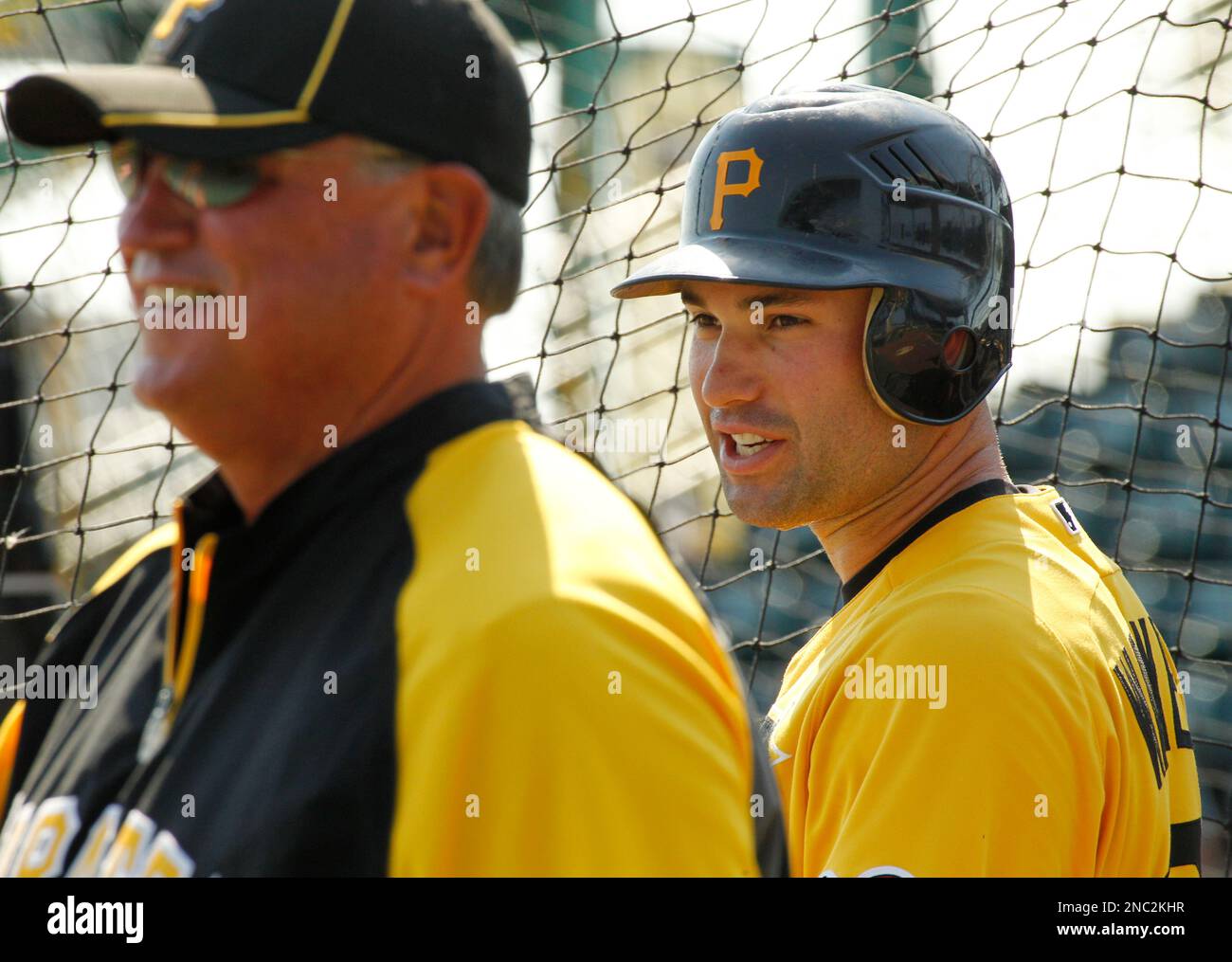 Pittsburgh Pirates' Neil Walker, right, talks with manager Clint Hurder ...