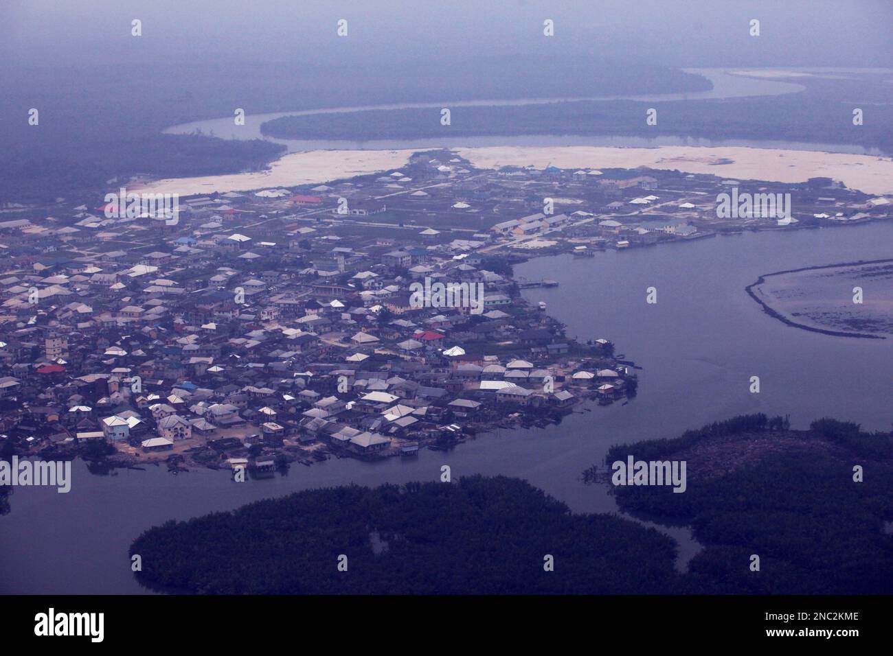 In this Thursday, March 24, 2011 photo, a cluster of houses is seen in ...