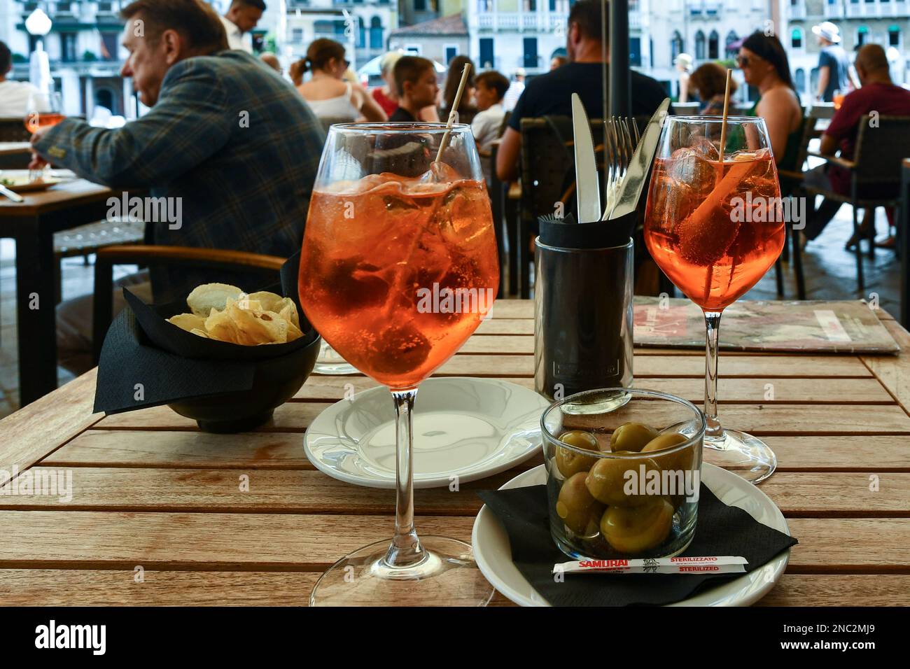 Two glasses of spritz, the typical Venetian aperitif, on a coffee table ...