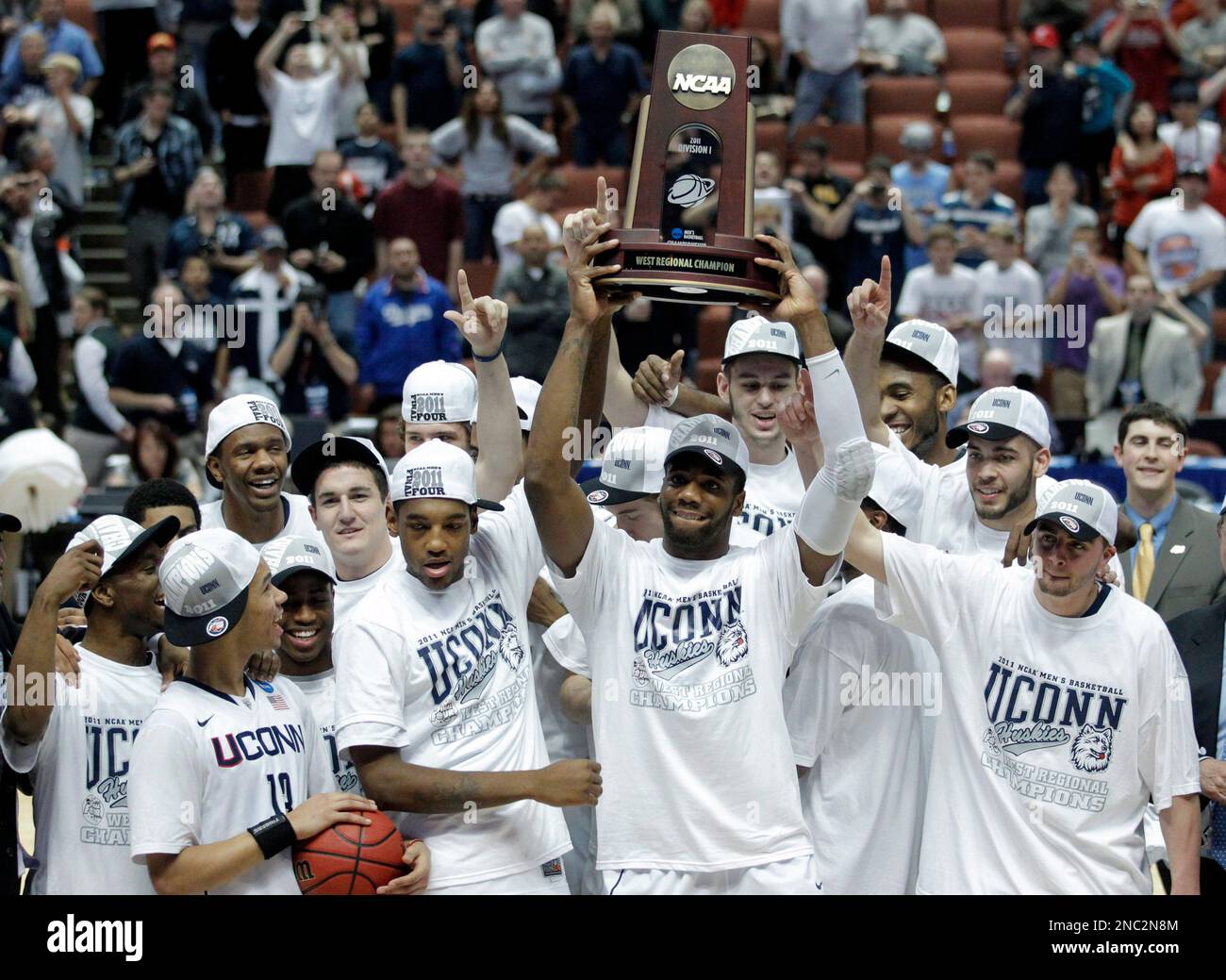 Connecticut's Alex Oriakhi holds the trophy celebrating with his ...