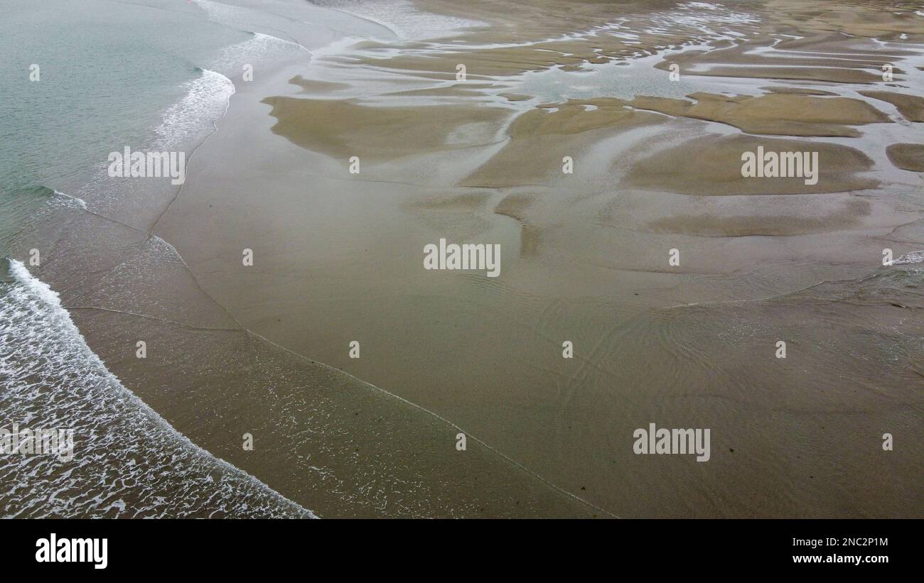 Sandy shore, top view. Minimalistic seascape, a copy space. Wet sand ...