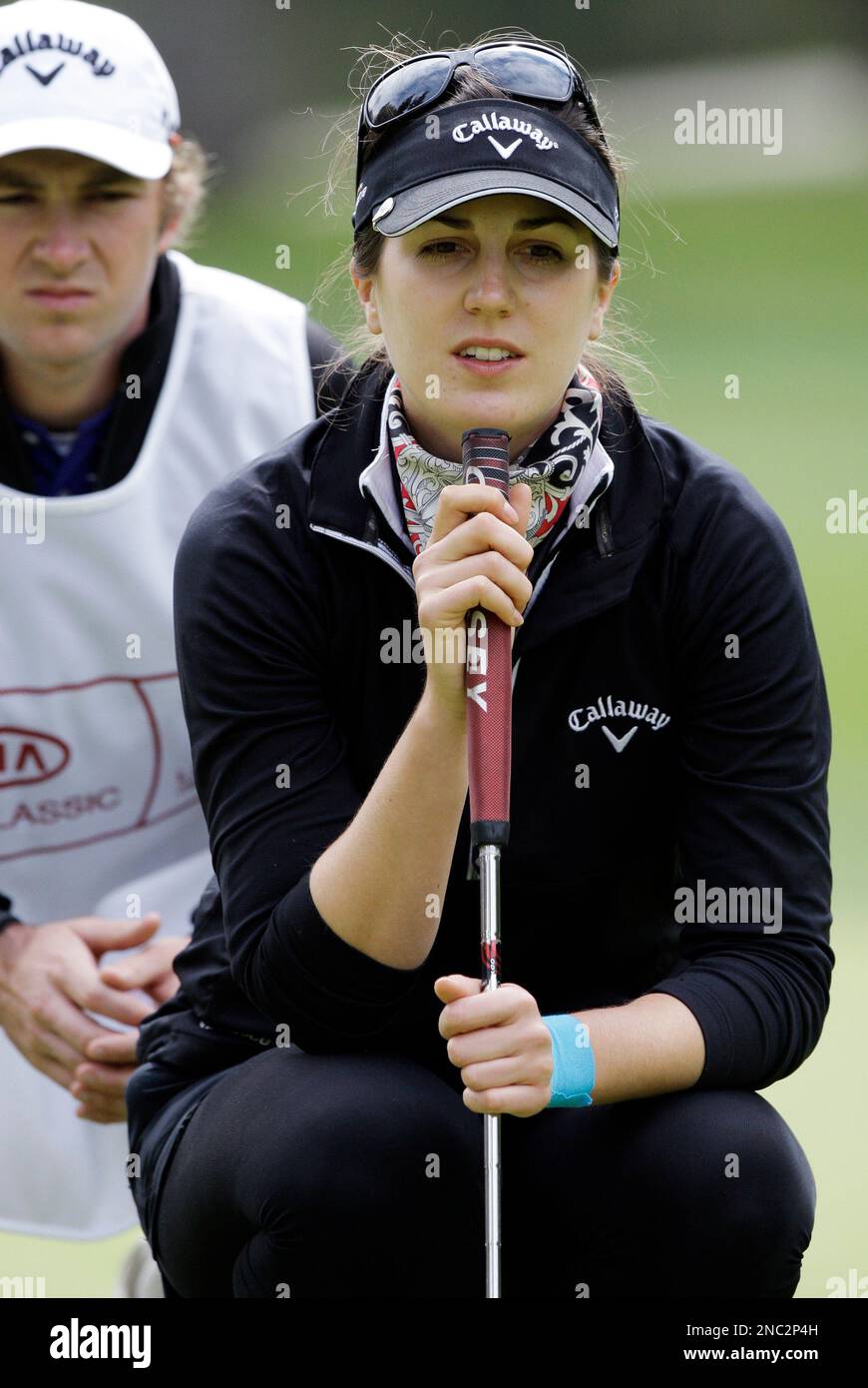 Sandra Gal, of Germany, eyes her putt on the third green during the ...