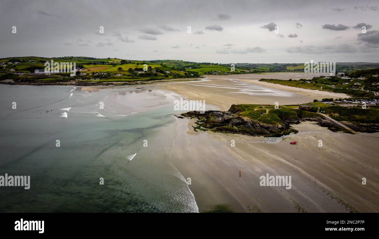 Grey sky, Inchydoney beach and Cape Virgin Mary on a summer day. The ...