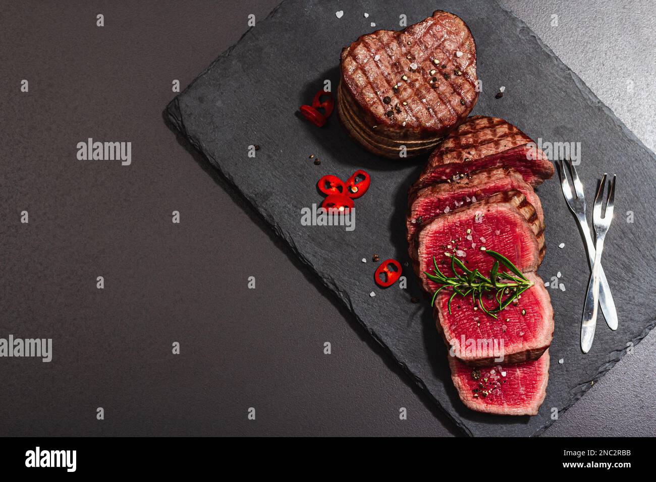 Rare cooking level Eye round steak with spices and herbs. Classic ...