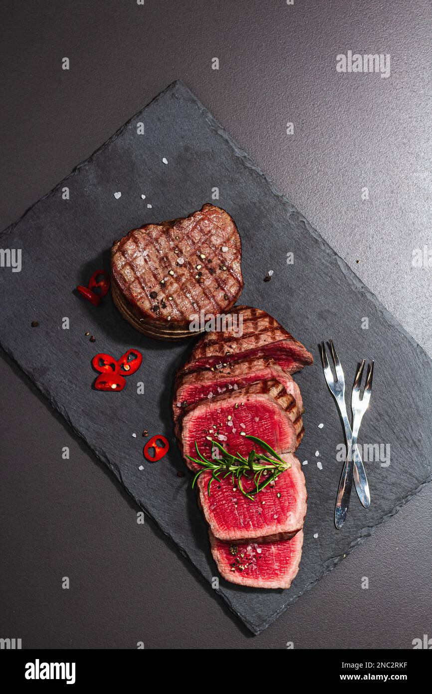 Rare cooking level Eye round steak with spices and herbs. Classic ...