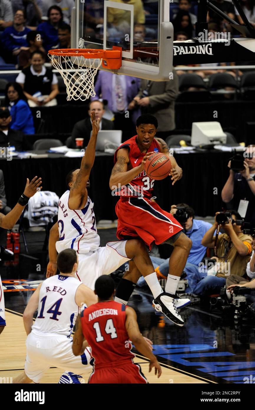 Richmond's Justin Harper rebounds during the second half of a Southwest ...