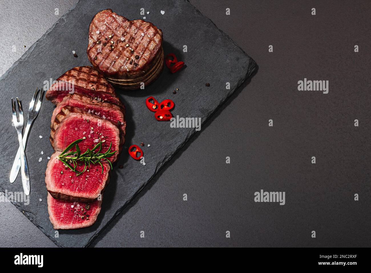 Rare cooking level Eye round steak with spices and herbs. Classic ...