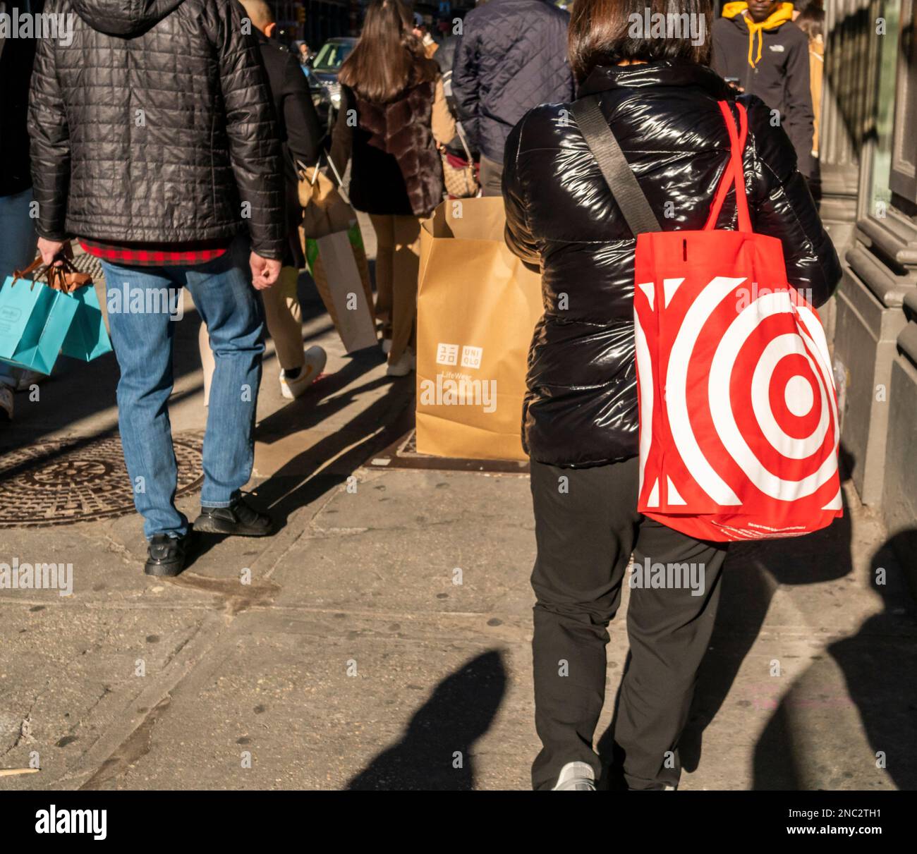 Shopper with a Target shopping bag joins crowds of shoppers in the Soho ...