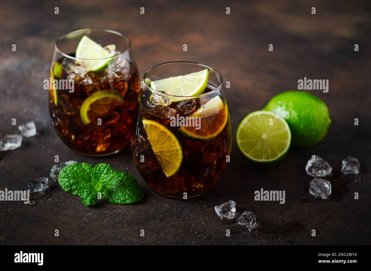 Cuba Libre with brown rum, cola and lime. Cuba Libre or long island cocktail Stock Photo - Alamy