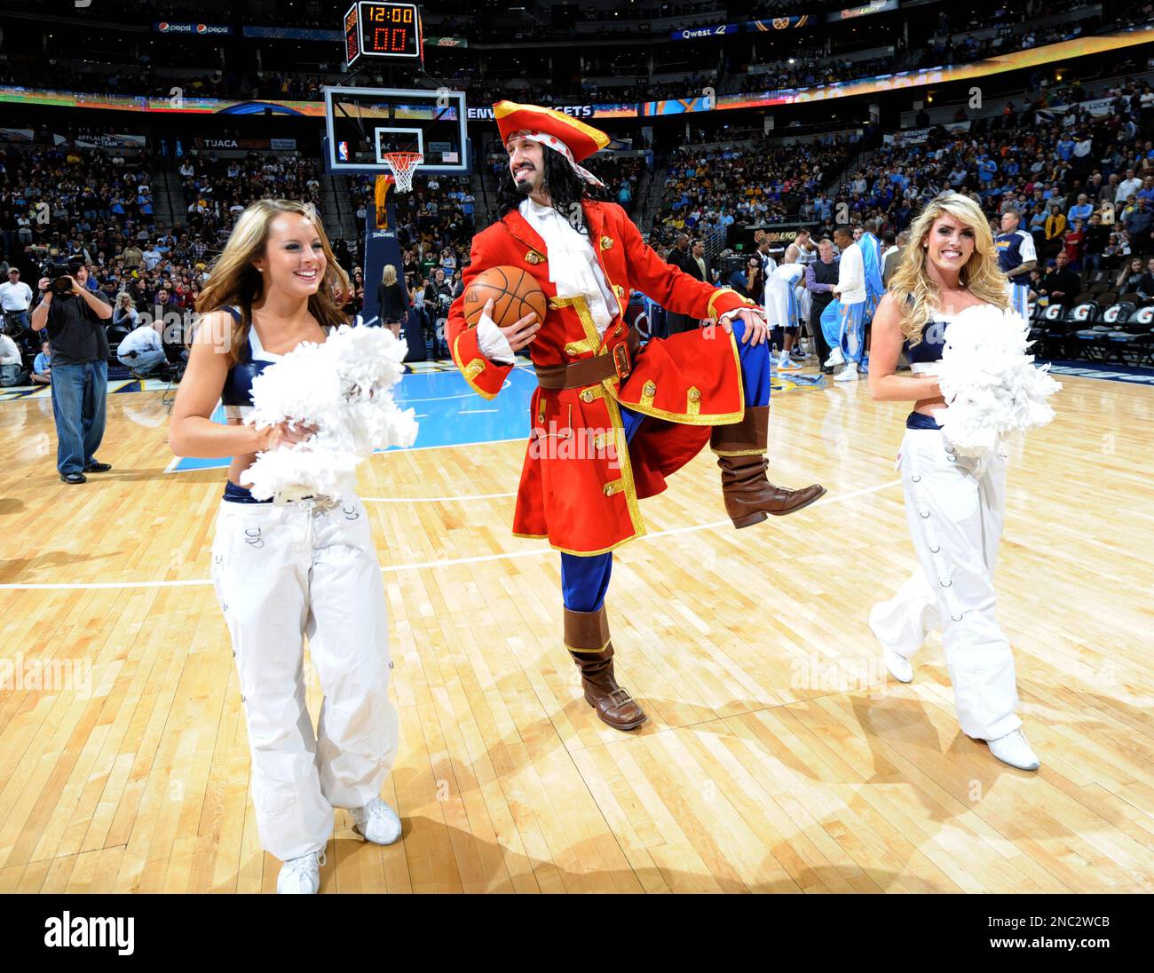 Captain Morgan strikes his legendary pose as he delivers the game ball ...