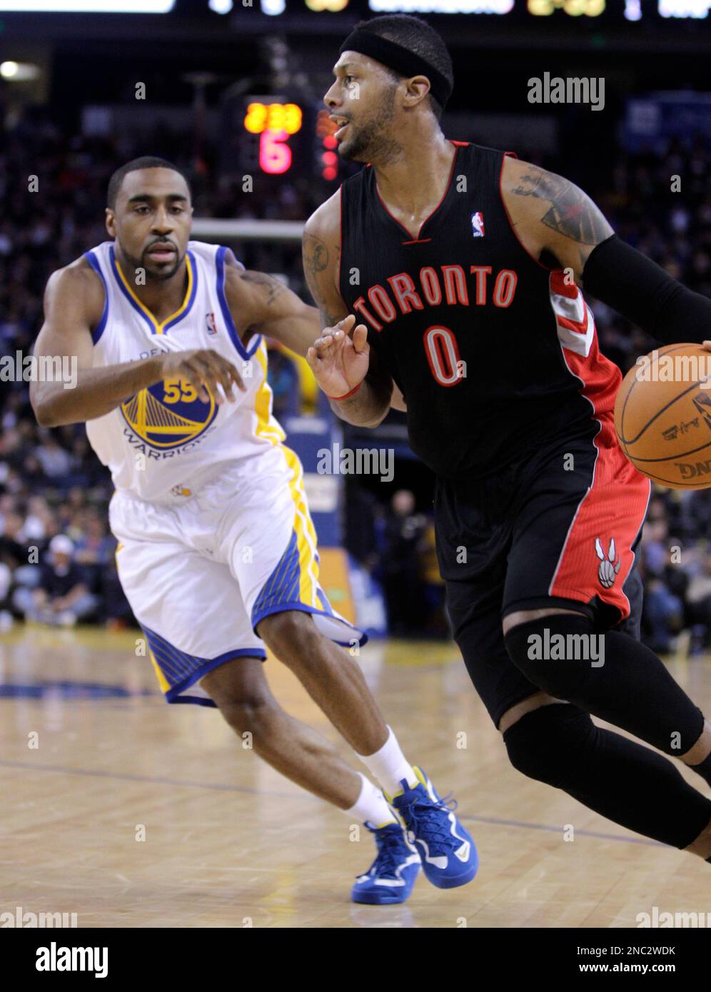 Toronto Raptors' James Johnson, right, drives the ball against Golden ...