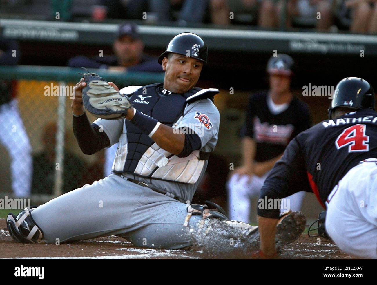 Detroit Tigers catcher Victor Martinez, left, tags out Atlanta Braves ...