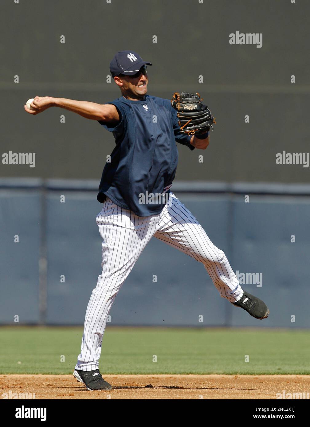 New York Yankees shortstop Derek Jeter throws during fielding drills ...