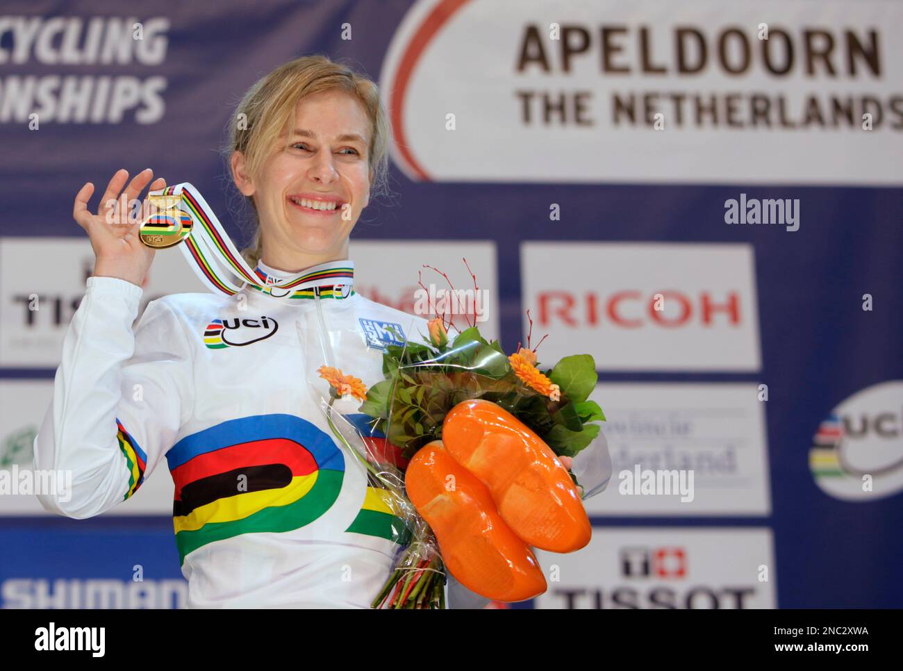 New world champion Sarah Hammer of the US shows her medal on the podium ...