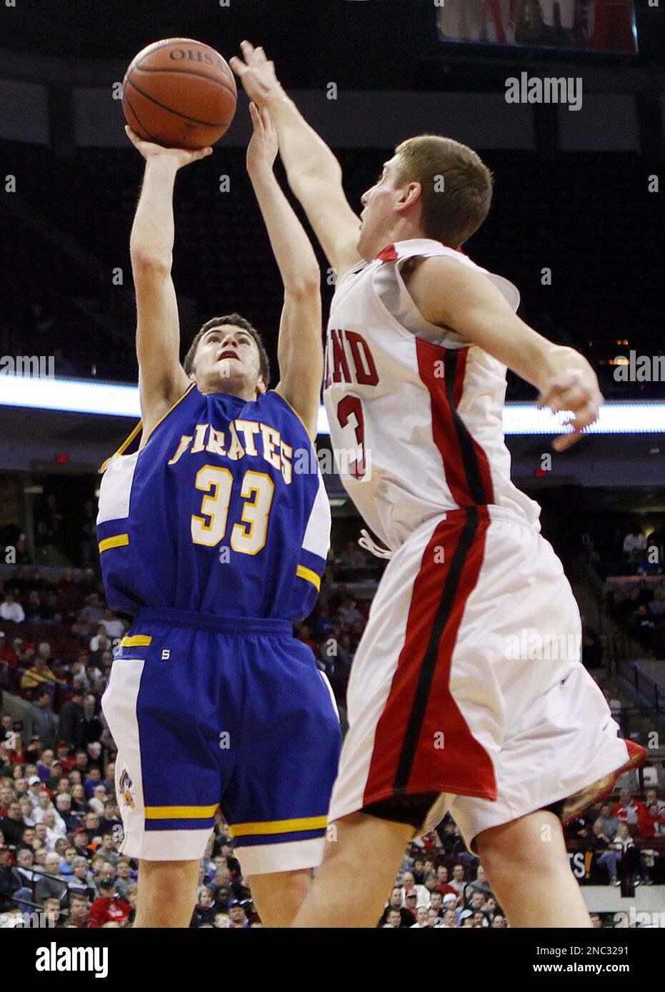 Continental's Dylan Geckle (33) shoots over Hiland's Dylan Kaufman ...