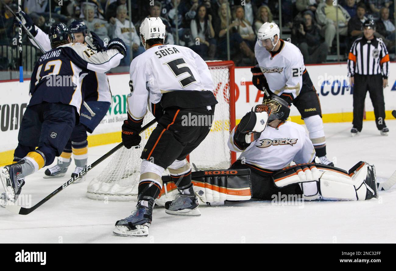 Anaheim Ducks goalie Jonas Hiller, of Switzerland, looks back after ...