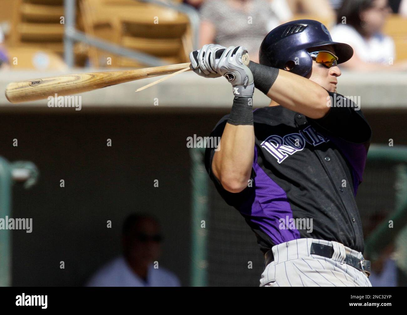 Colorado Rockies' Mike Jacobs hits a single against the Los Angeles ...